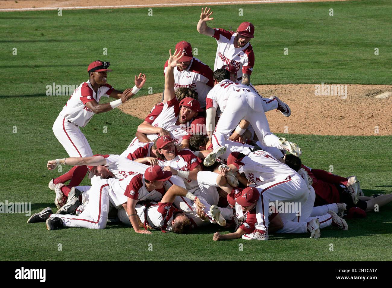 FAYETTEVILLE, AR - JUNE 10: The Arkansas Razorbacks team rushes the ...