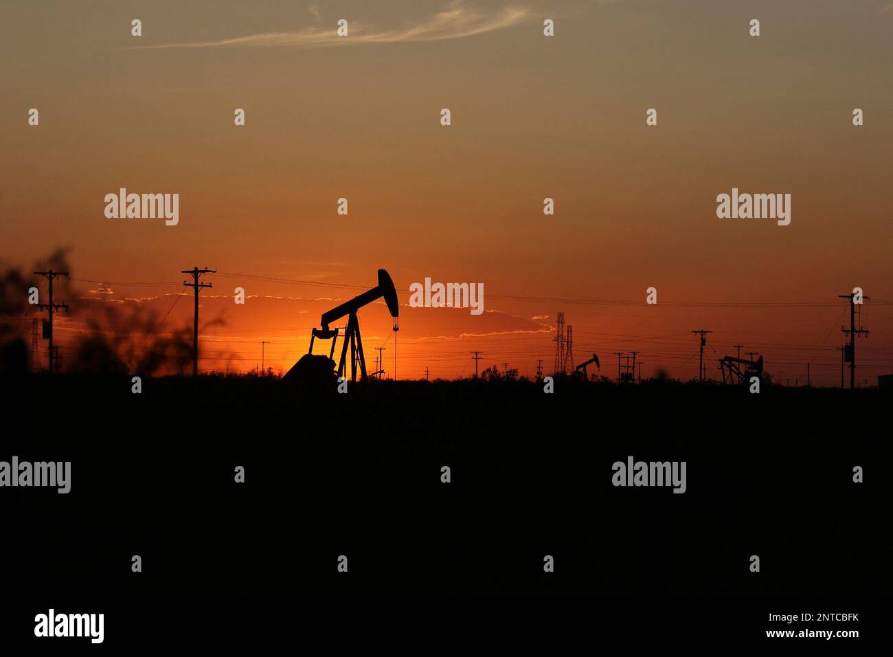 A pump jack operates in an oil field, Tuesday, June 11, 2019, in the ...