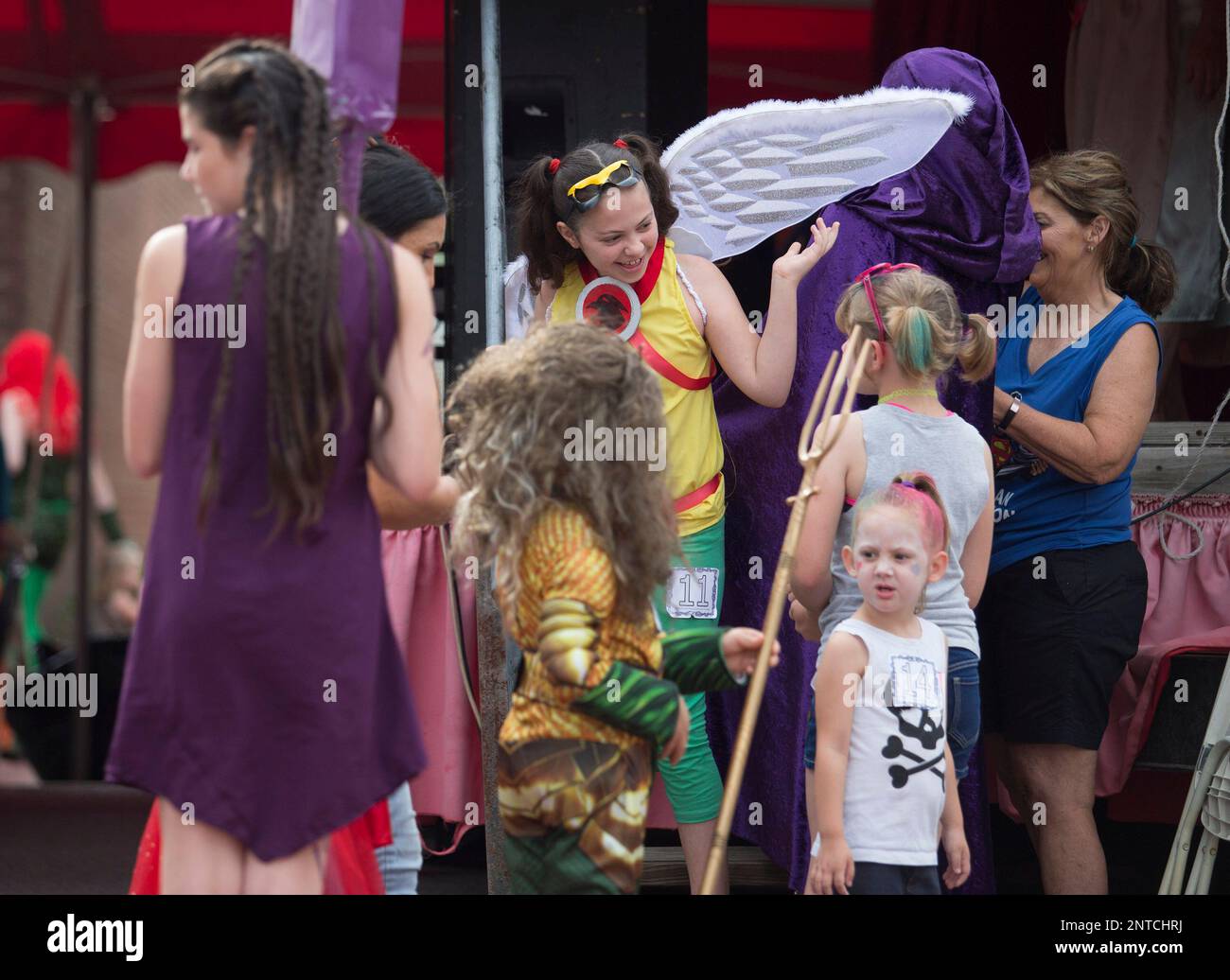 Kids wait to be called onto the stage for the Kids Superhero Costume ...
