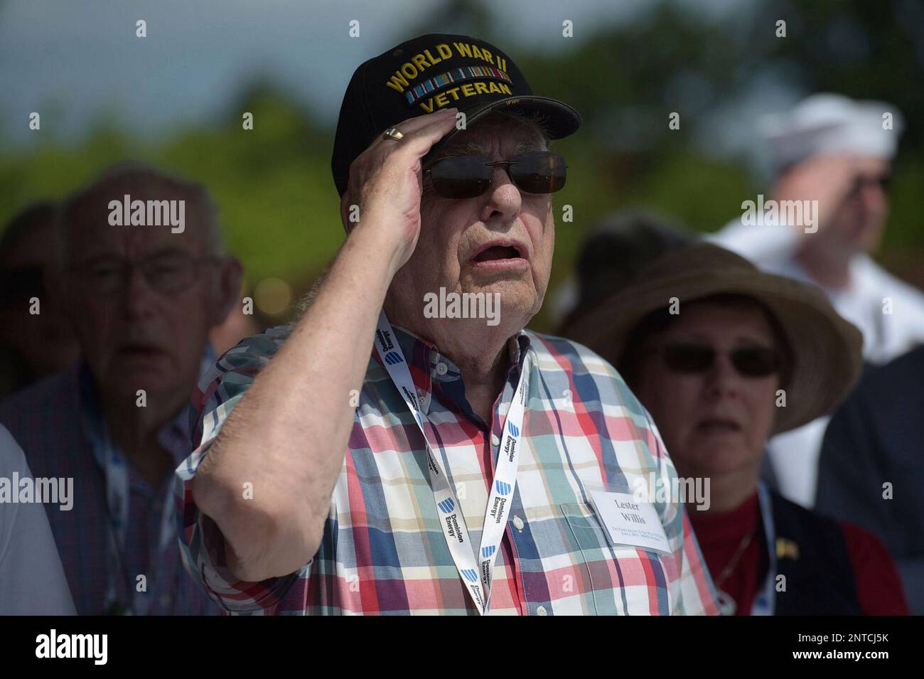 WWII Veteran Lester Willis salutes during the National Anthem during ...