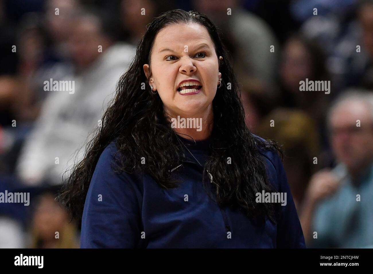 Xavier head coach Melanie Moore reacts in in the first half of an NCAA ...