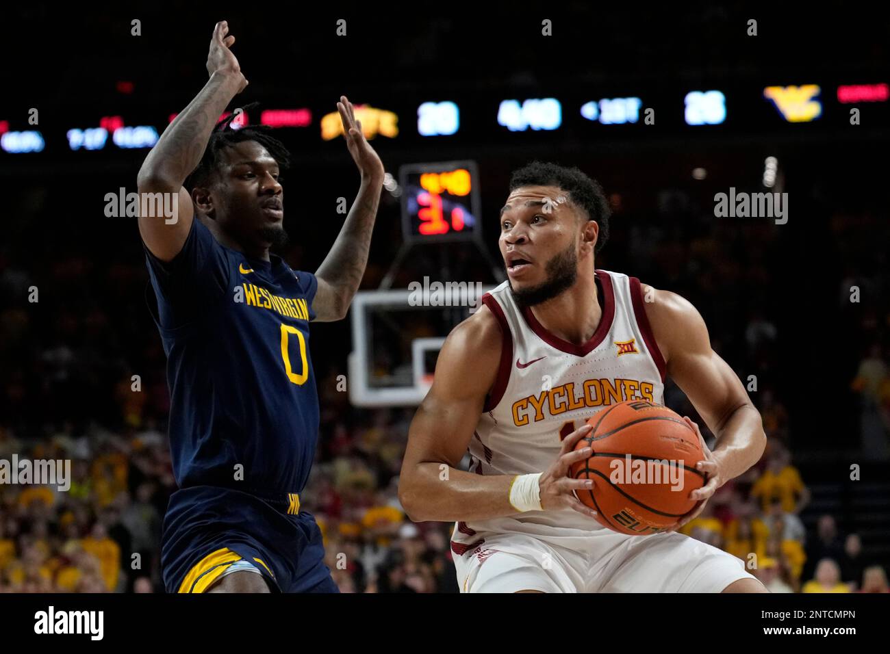Iowa State guard Jaren Holmes drives to the basket past West Virginia ...