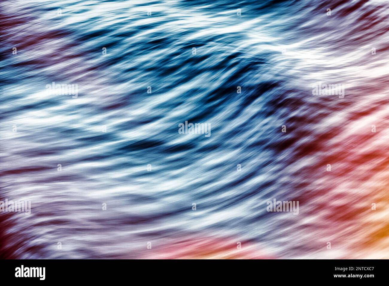 Water moves, sunlight on water surface reflected in the colours of the ...