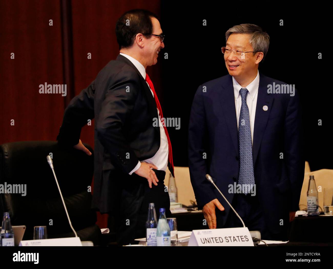 U.S. Treasury Secretary Steven Mnuchin, left, talks with China's ...