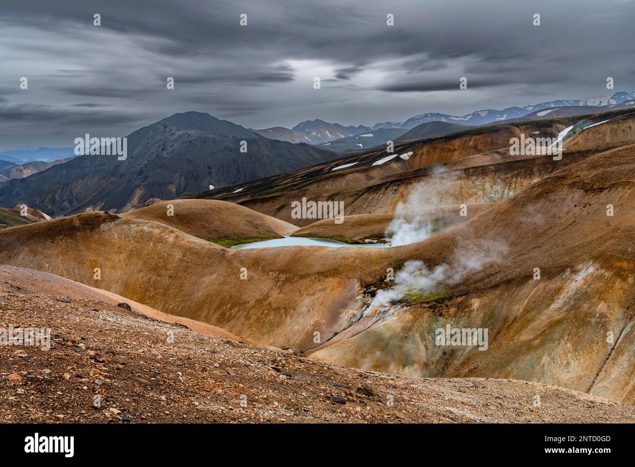 Steaming hot springs, colourful rhyolite mountains, volcanic landscape ...