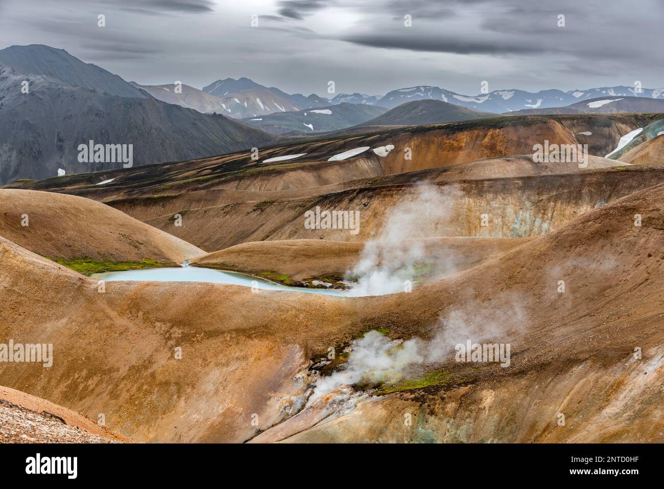 Steaming hot springs, colourful rhyolite mountains, volcanic landscape ...