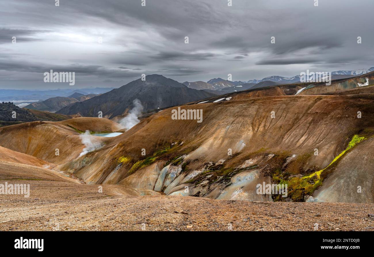 Steaming hot springs, colourful rhyolite mountains, volcanic landscape ...