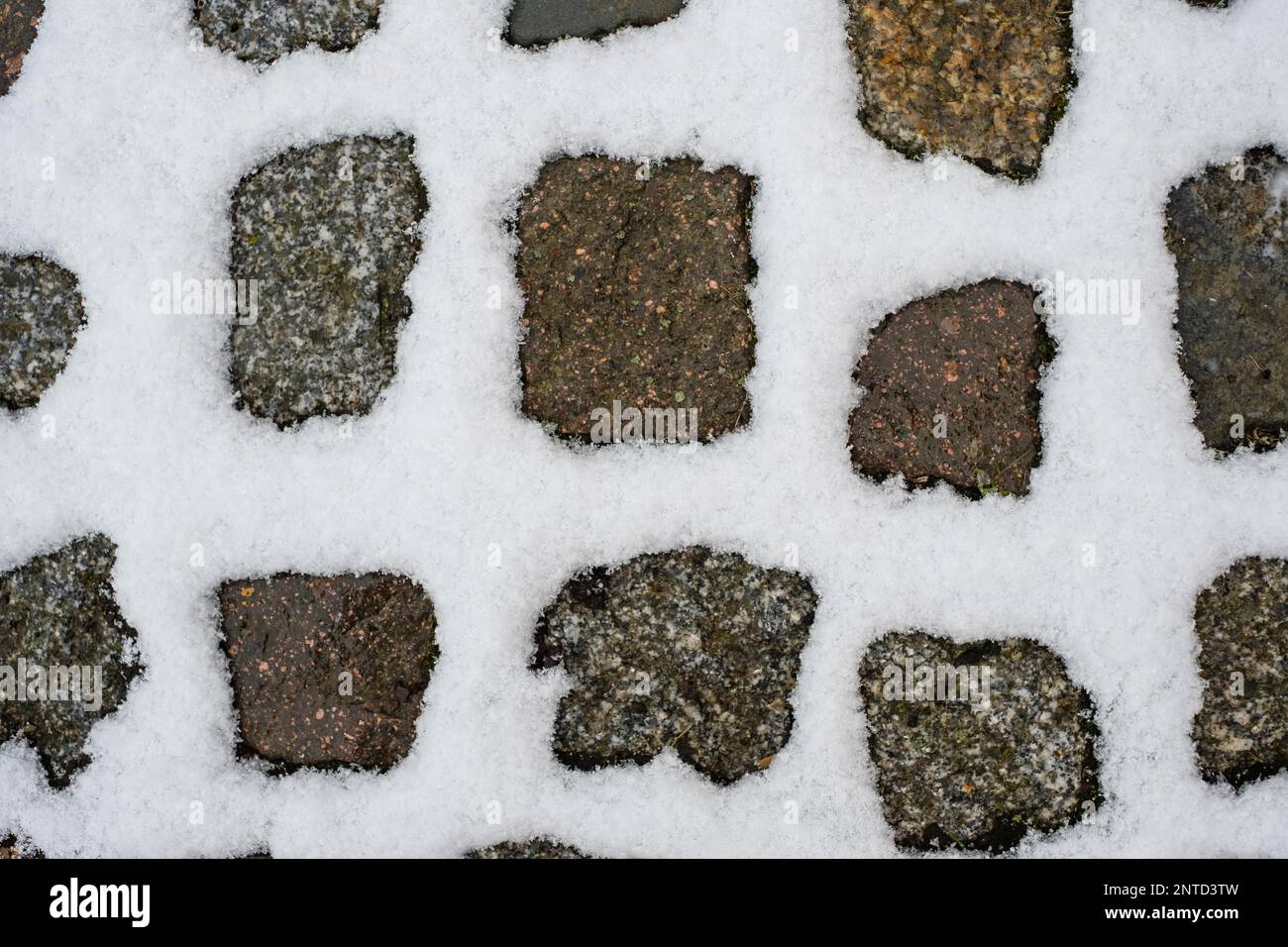Paving stones with snow Stock Photo - Alamy