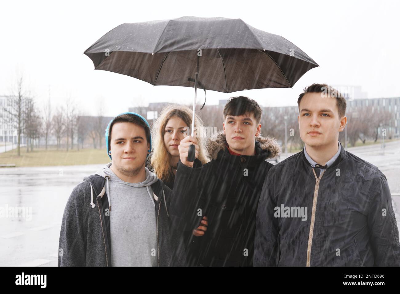 Group under one umbrella hi-res stock photography and images - Alamy