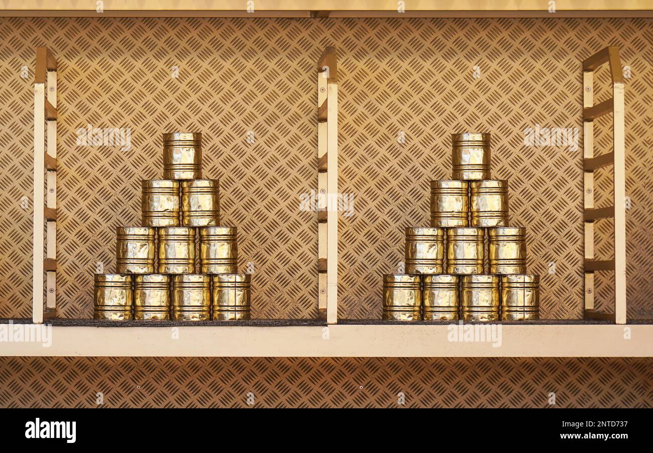 stacked tin can pyramid for can knockdown game at funfair, known as ...