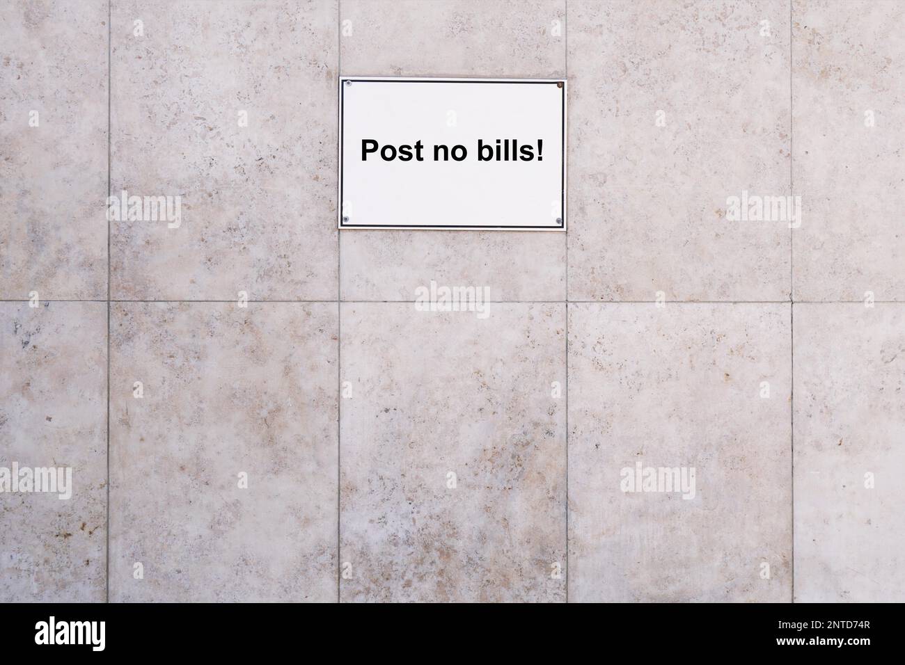 prohibition sign reads post no bills, marble textured stone wall ...