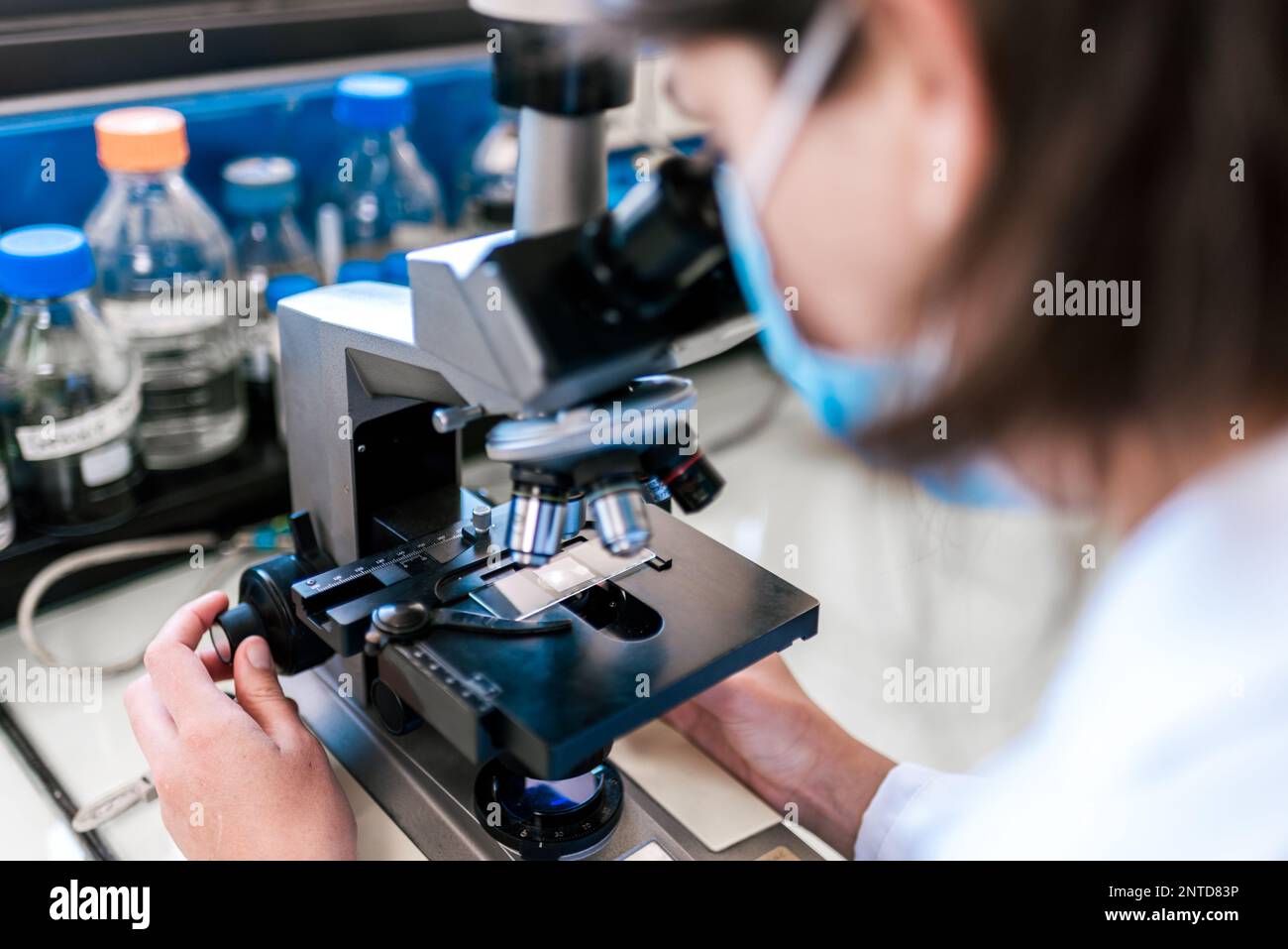 Female Scientist Using Microscopy in Laboratory closeup Stock Photo - Alamy