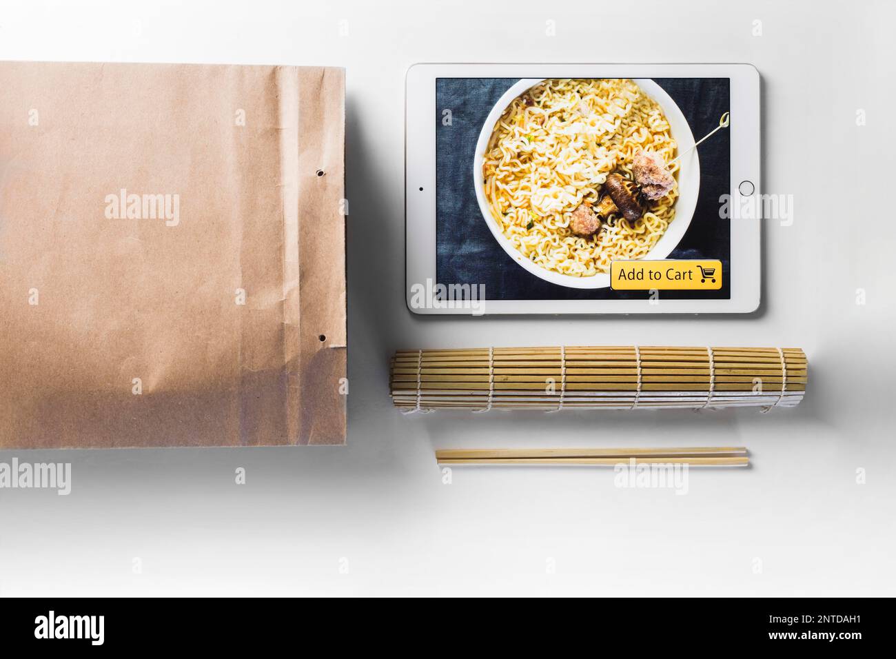 paper bag near tablet Stock Photo - Alamy