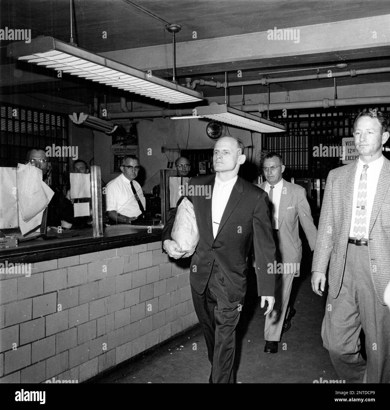 Suspect in The Temple bombing case Wallace H. Allen, carrying paper bag ...