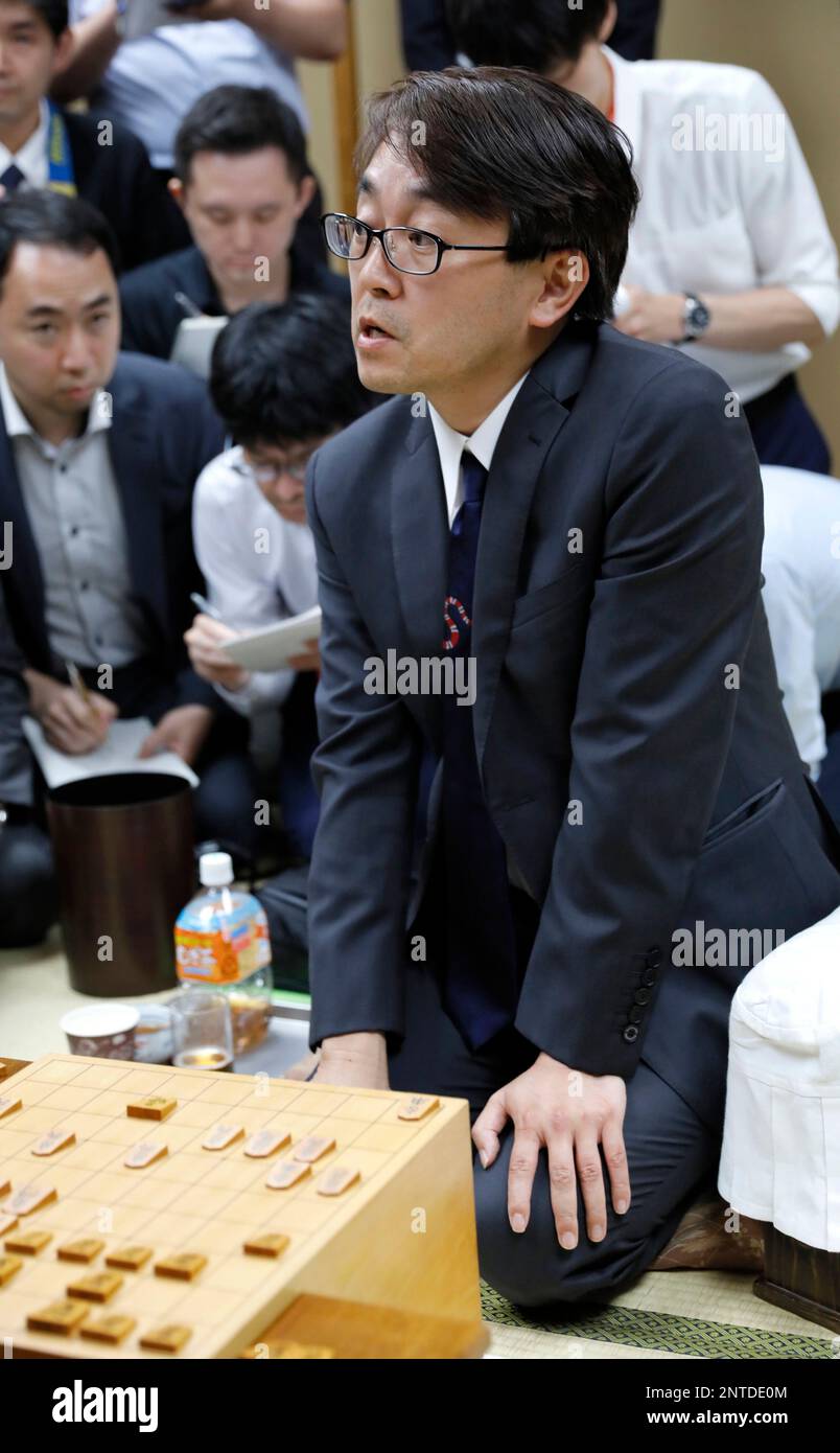 Japanese professional shogi player Yoshiharu Habu reacts after ...