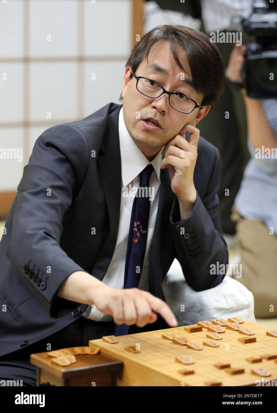 Japanese professional shogi player Yoshiharu Habu reacts after ...