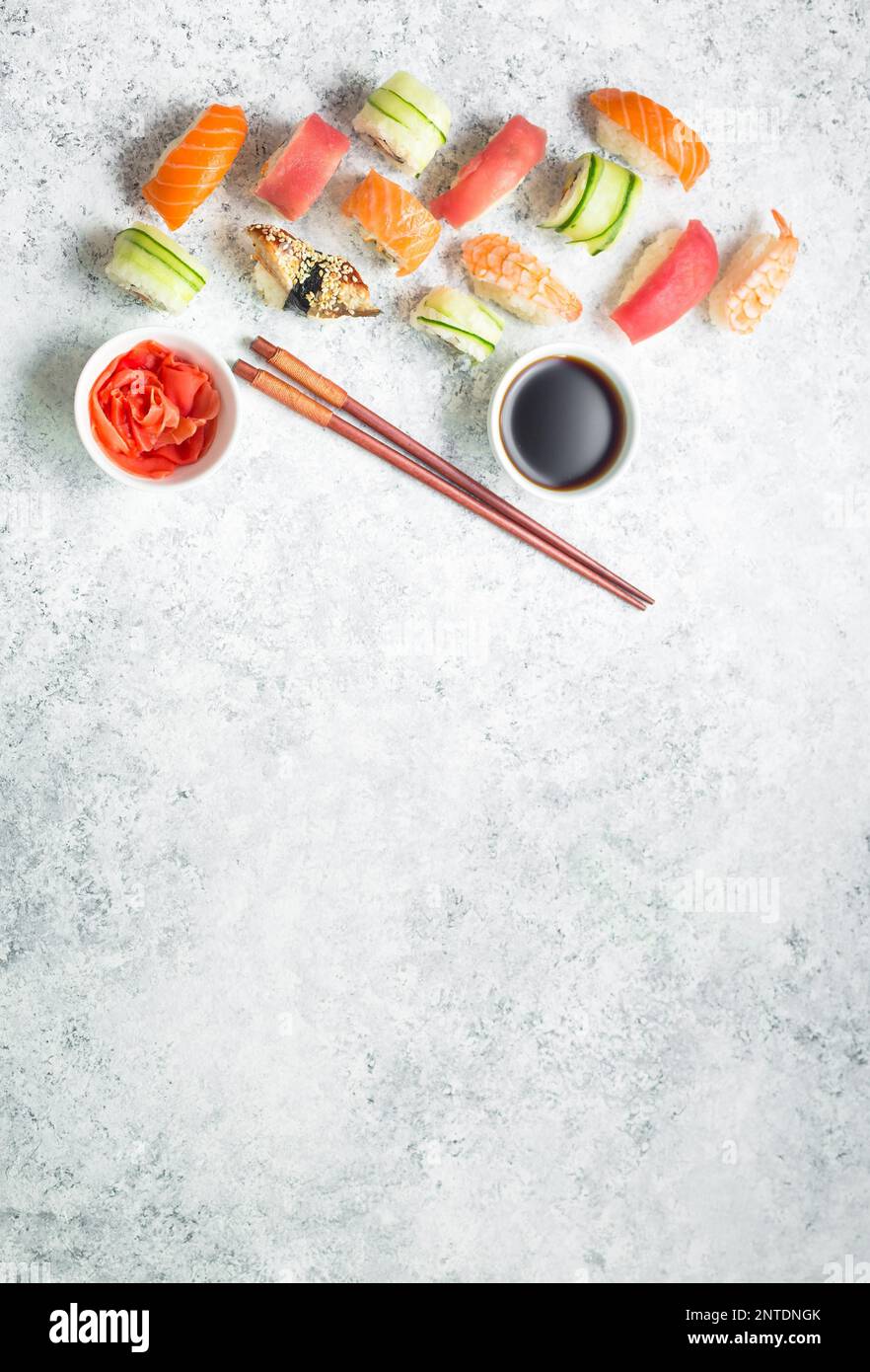 Assorted sushi set on white concrete background. Space for text ...