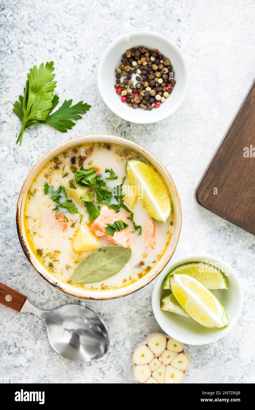 Salmon soup with potatoes, carrot, cream, herbs. Scandinavian/Norwegian ...