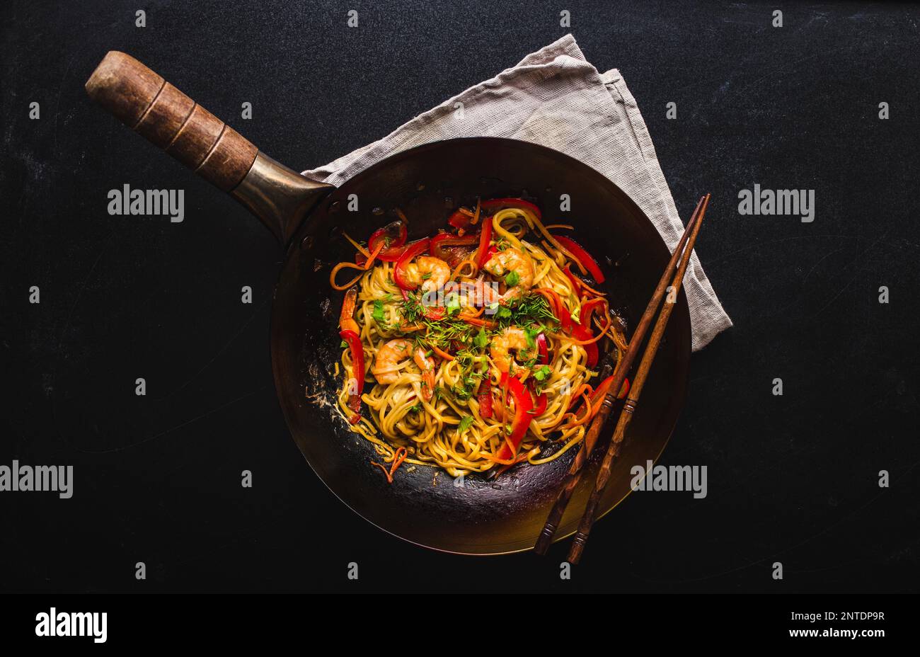 Stir fry noodles in traditional Chinese wok, chopsticks. Asian noodles ...