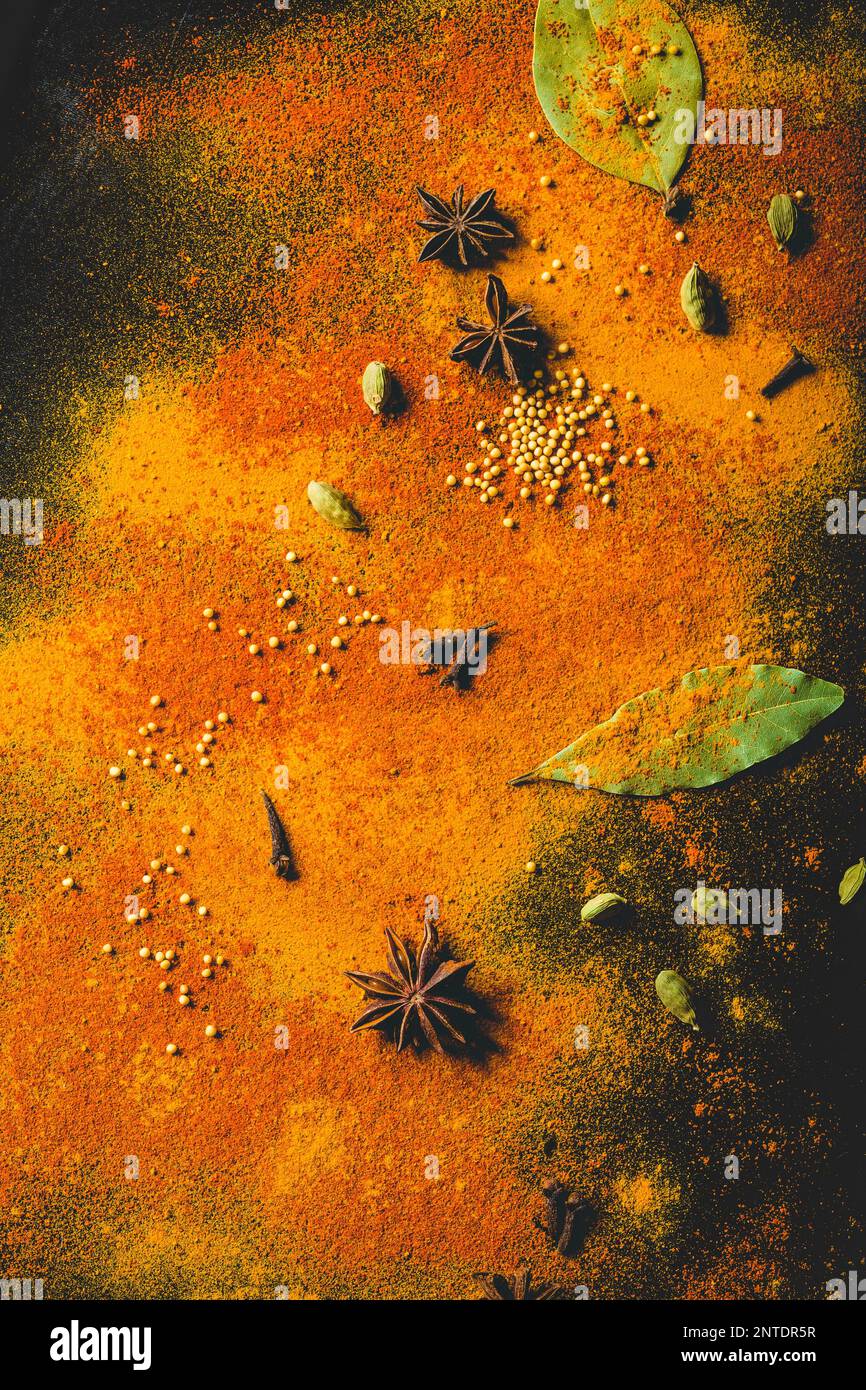 Assorted spices on dark black background. Seasonings for food. Curry ...