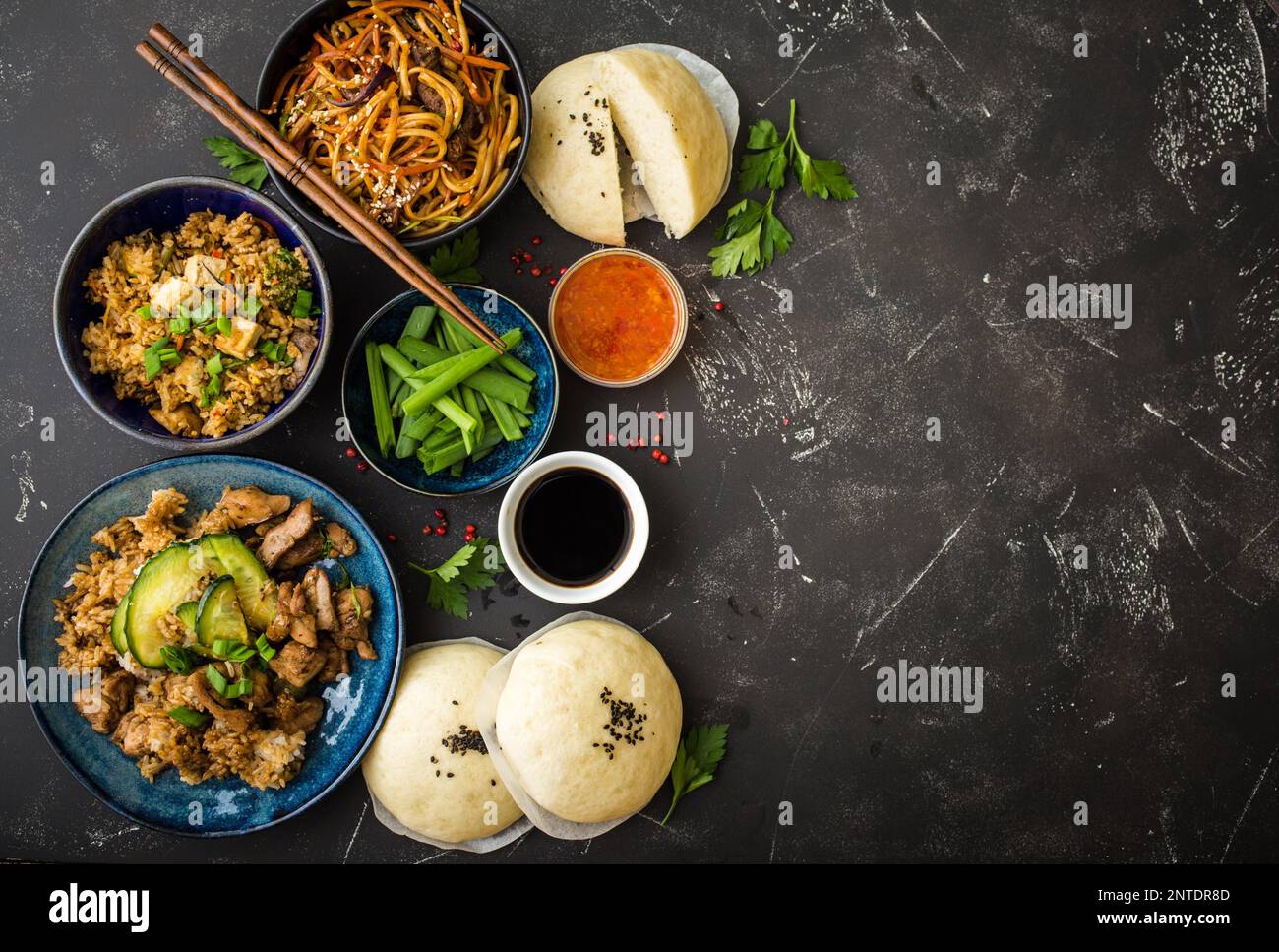 Asian assorted food set, dark rustic stone background. Chinese dishes ...