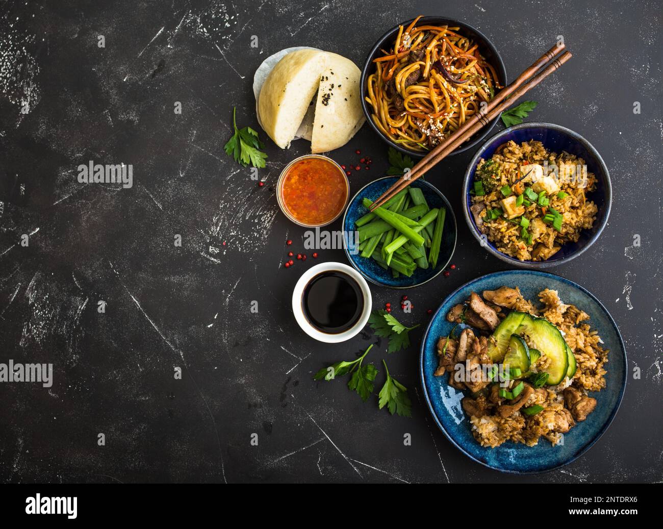 Asian assorted food set, dark rustic stone background. Chinese dishes ...