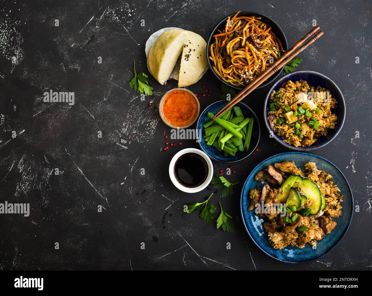 Asian assorted food set, dark rustic stone background. Chinese dishes ...