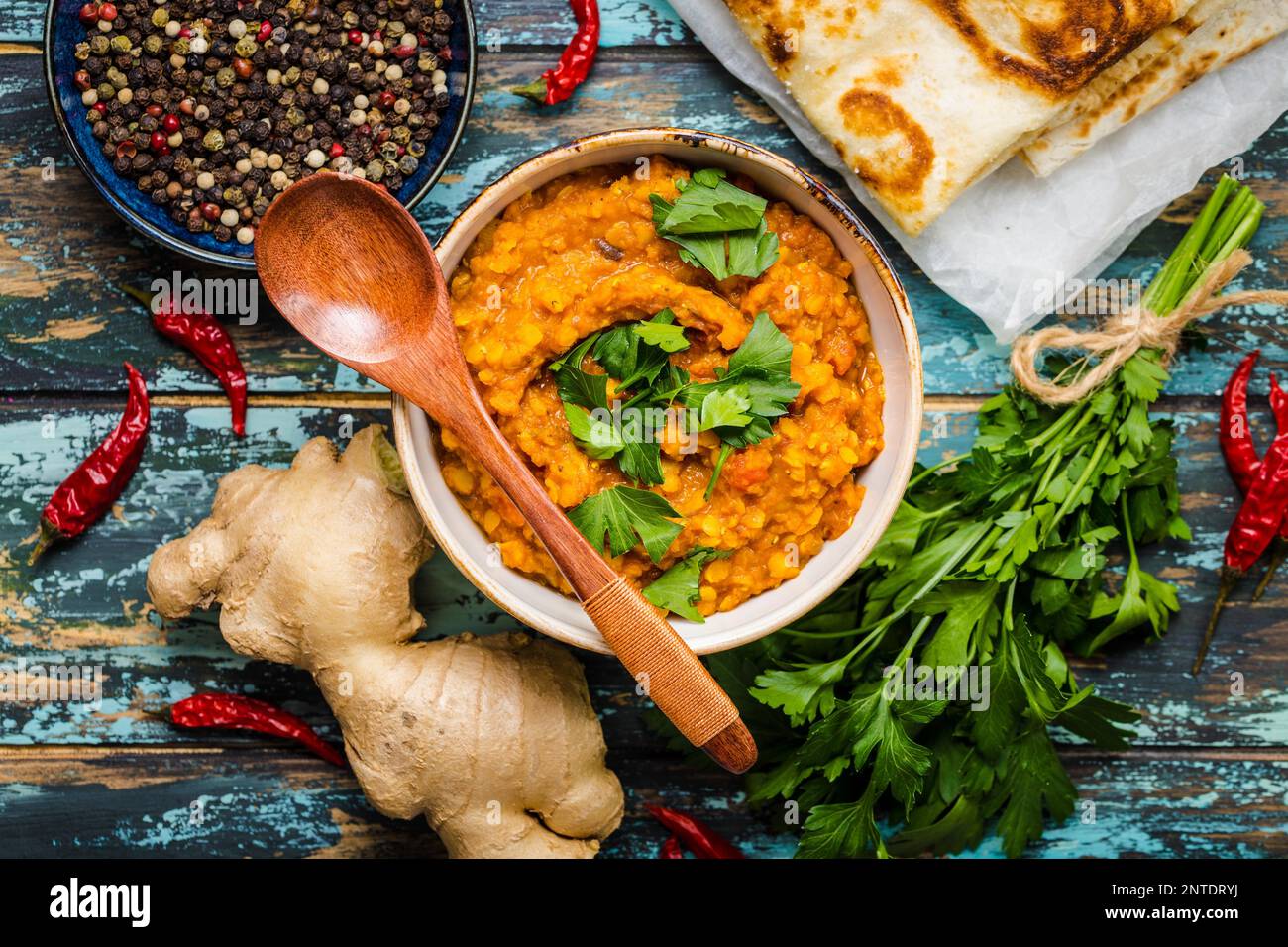 Traditional Indian lentils Dal, naan butter bread, fresh coriander ...