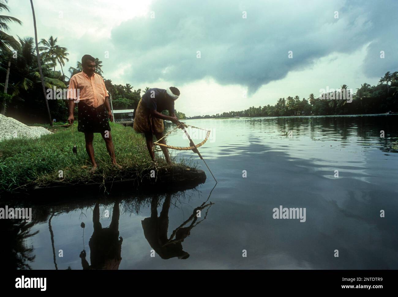 Fishing with bow and arrow, the traditional way in Kuttanad, Kerala ...