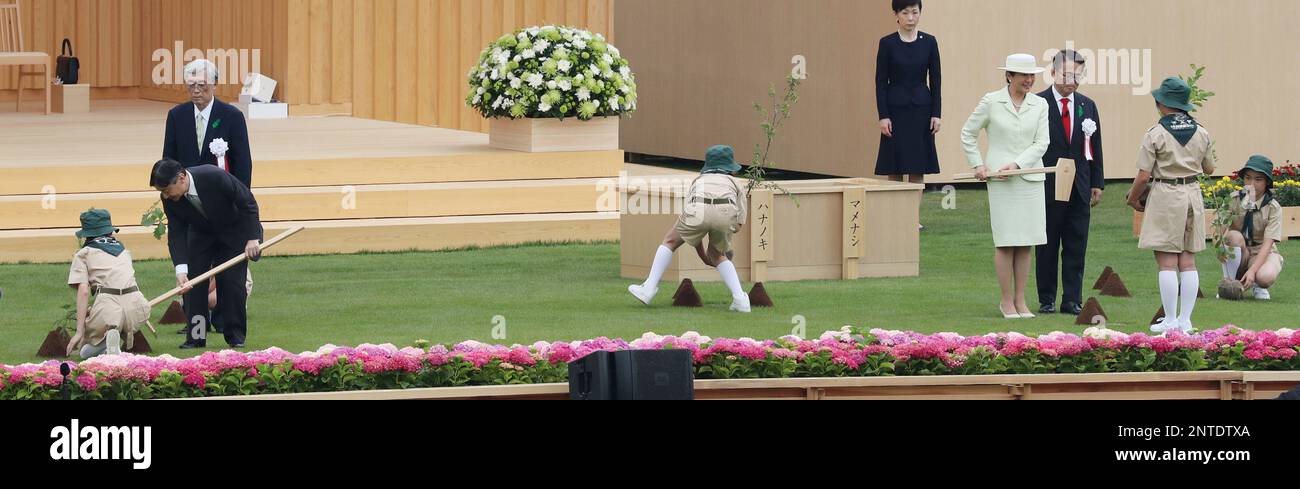 Japan's Emperor Naruhito and Empress Masako plant a tree during the ...
