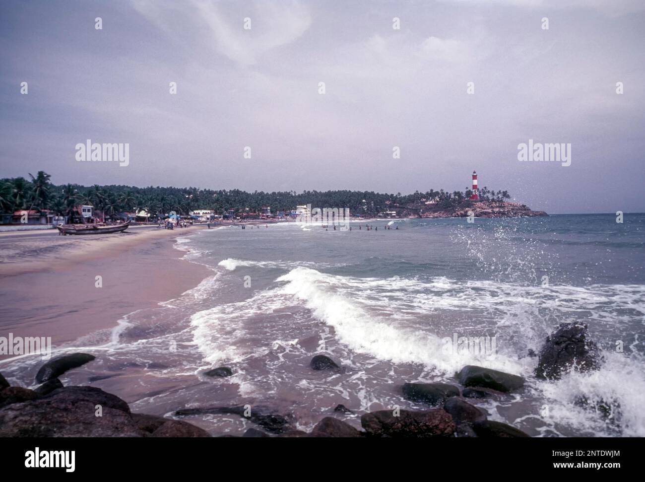 Kovalam, stretches of golden sand beach, fringed by coconut palms, very ...