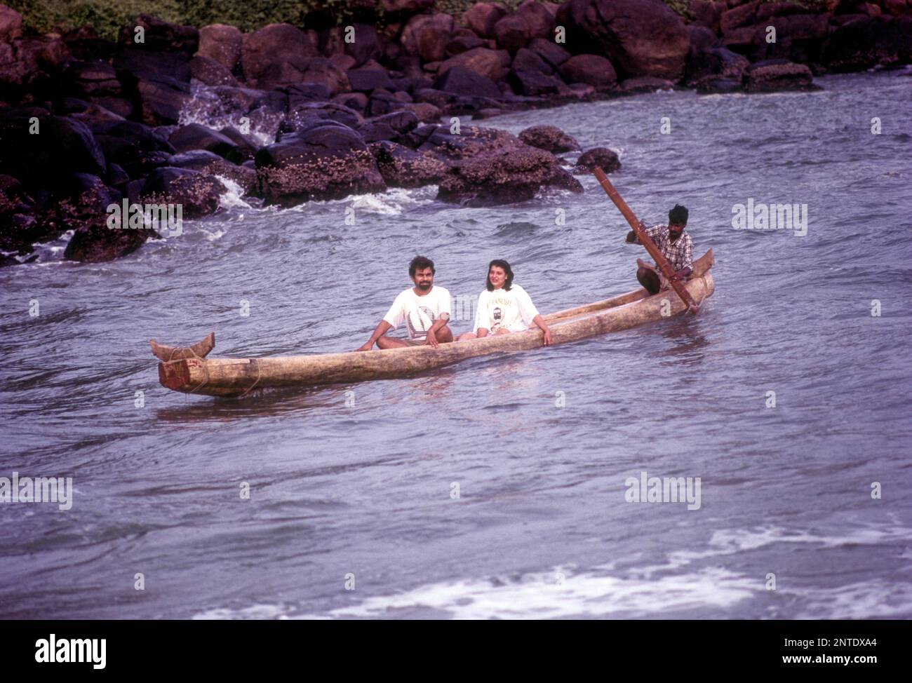 Tourists enjoying ride on Catamaran in Kovalam beach near ...