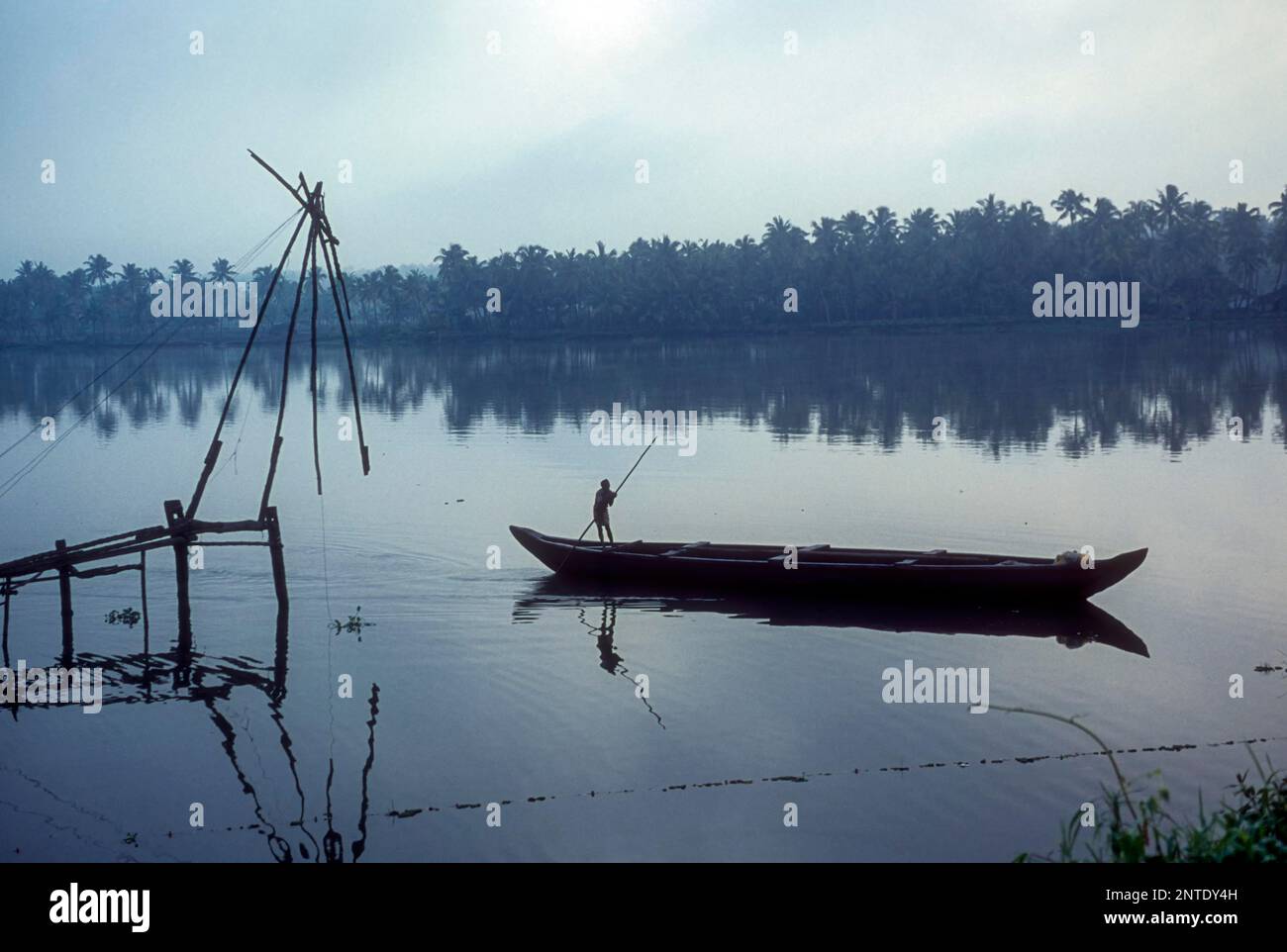Chinese fishing net and a fishing boat backwaters of Kodungallur ...