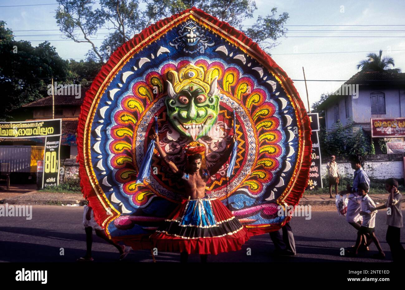 A person with a big mask in a festival procession, Thrissur Trichur ...