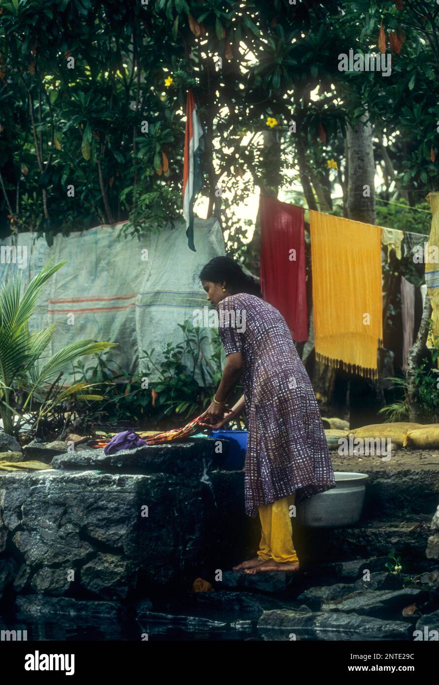 A woman washing clothes, Kerala, South India, India, Asia Stock Photo ...