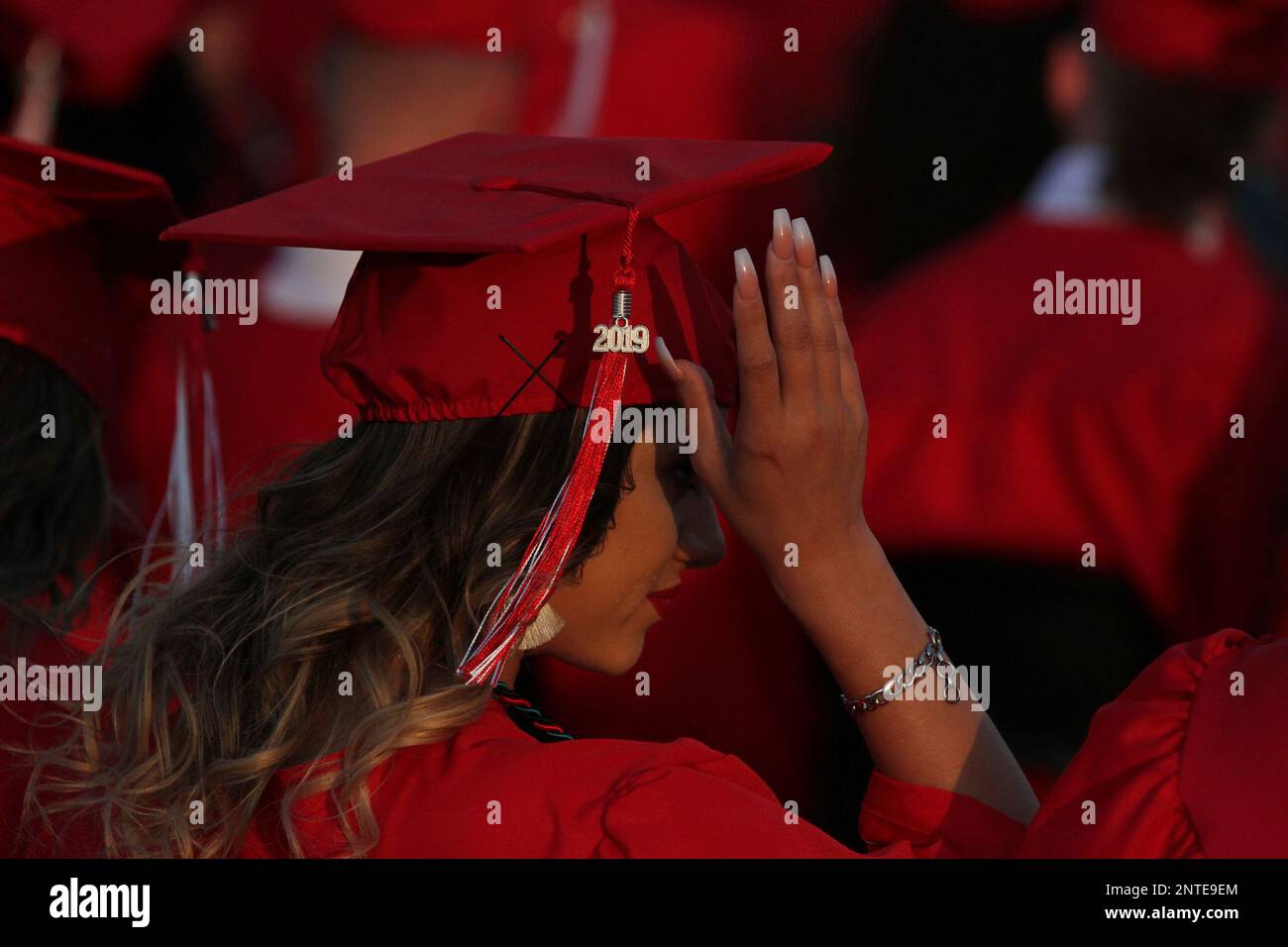 Odessa High School graduate Adamariz Heurtas shades her eyes from the ...