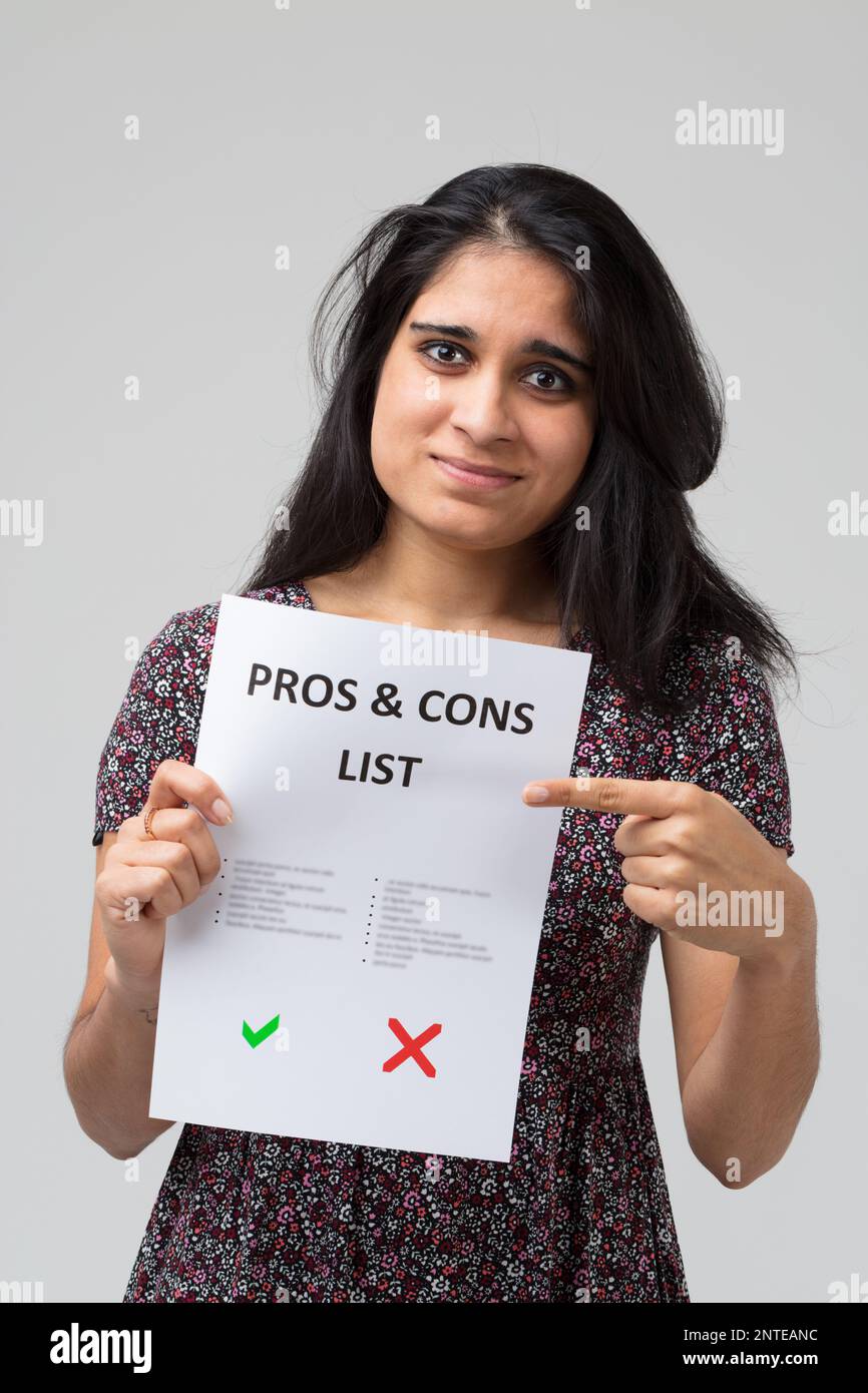 Upright portrait of young Indian woman with long black hair and a ...