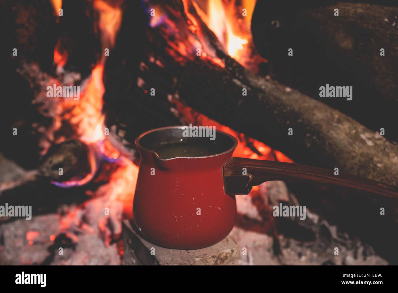 Warm by the fire, cozy winter night in the scandinavian cottage house ...