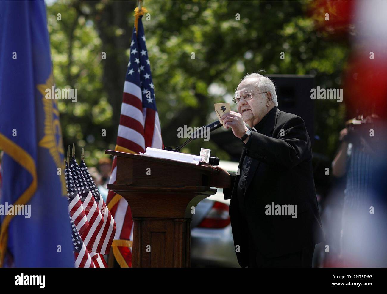 Monsignor Constantine Siconolfi holds up a Western Union telegram that ...
