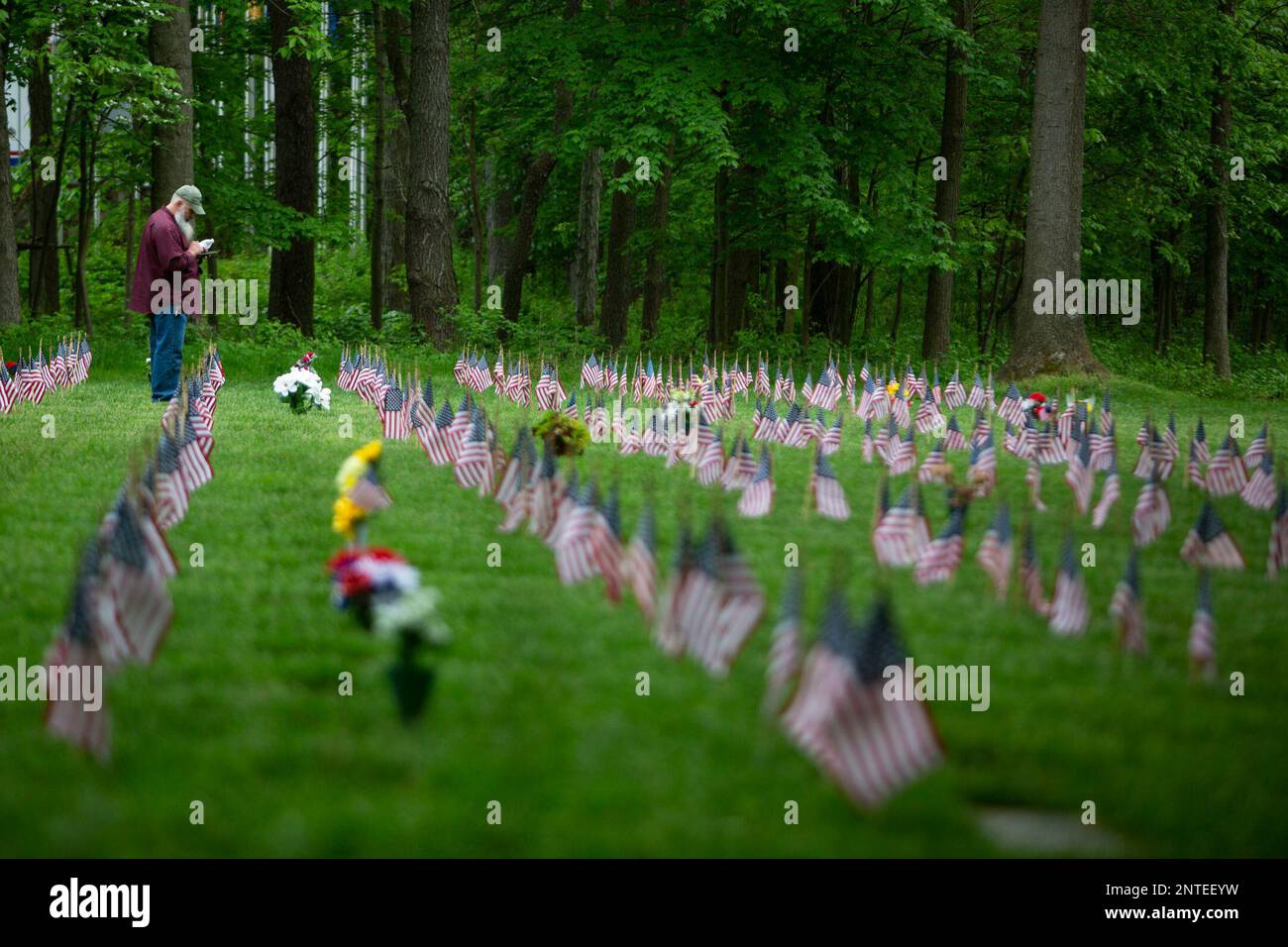 In this Sunday, May 26, 2019, photo a man attends a Memorial Day ...