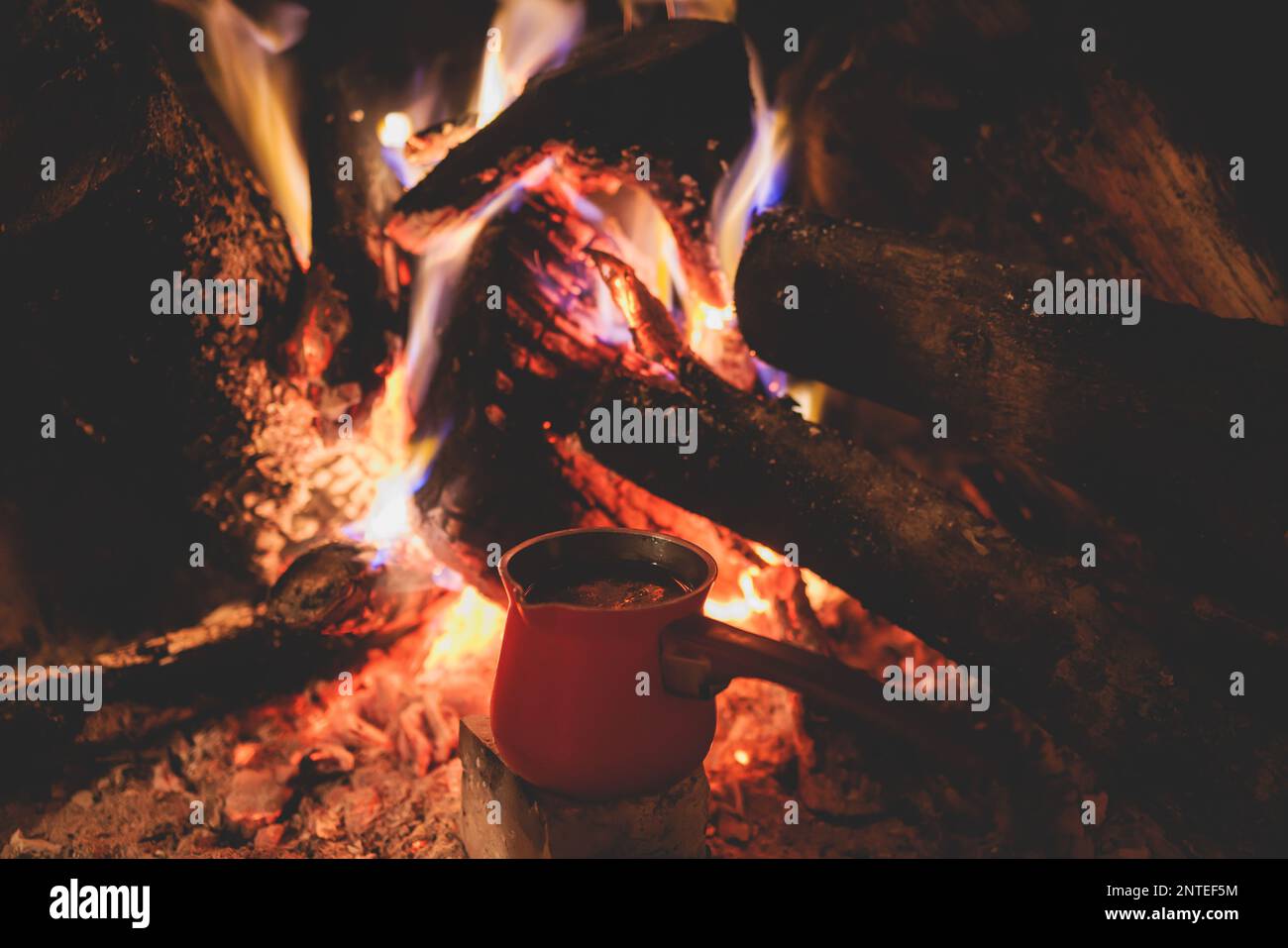 Warm by the fire, cozy winter night in the scandinavian cottage house ...