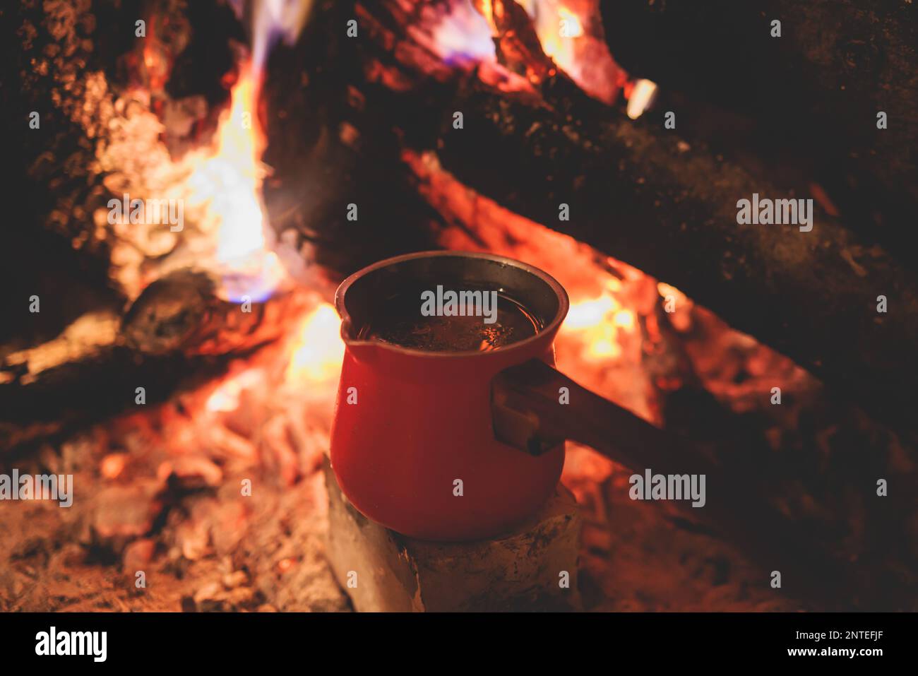 Warm by the fire, cozy winter night in the scandinavian cottage house ...