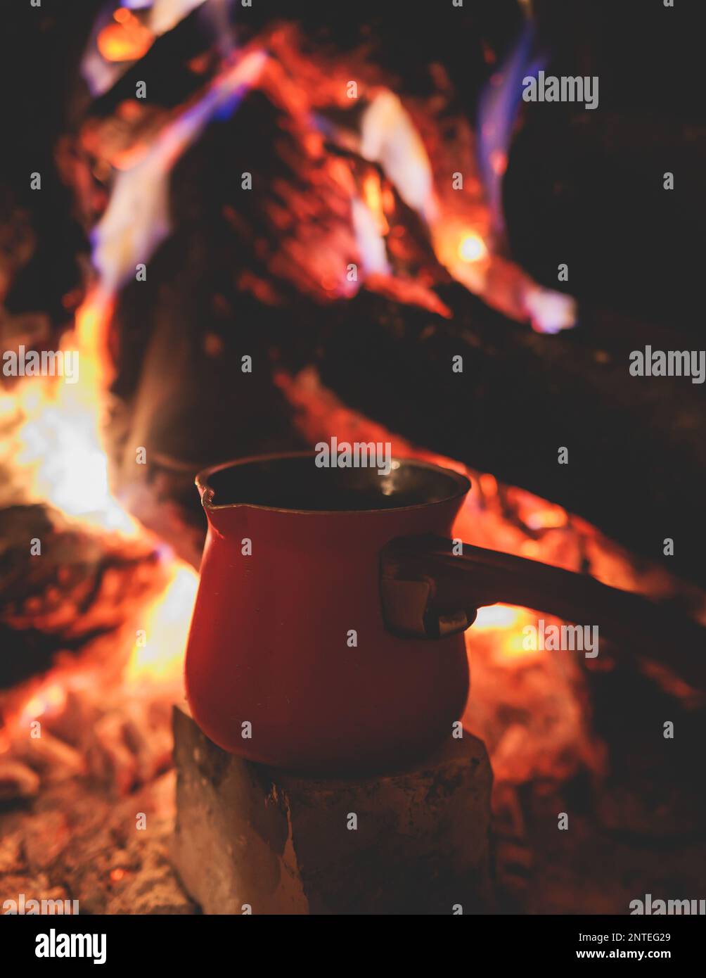 Warm by the fire, cozy winter night in the scandinavian cottage house ...