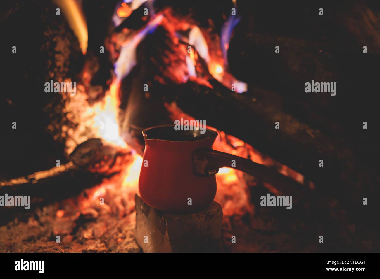 Warm by the fire, cozy winter night in the scandinavian cottage house ...