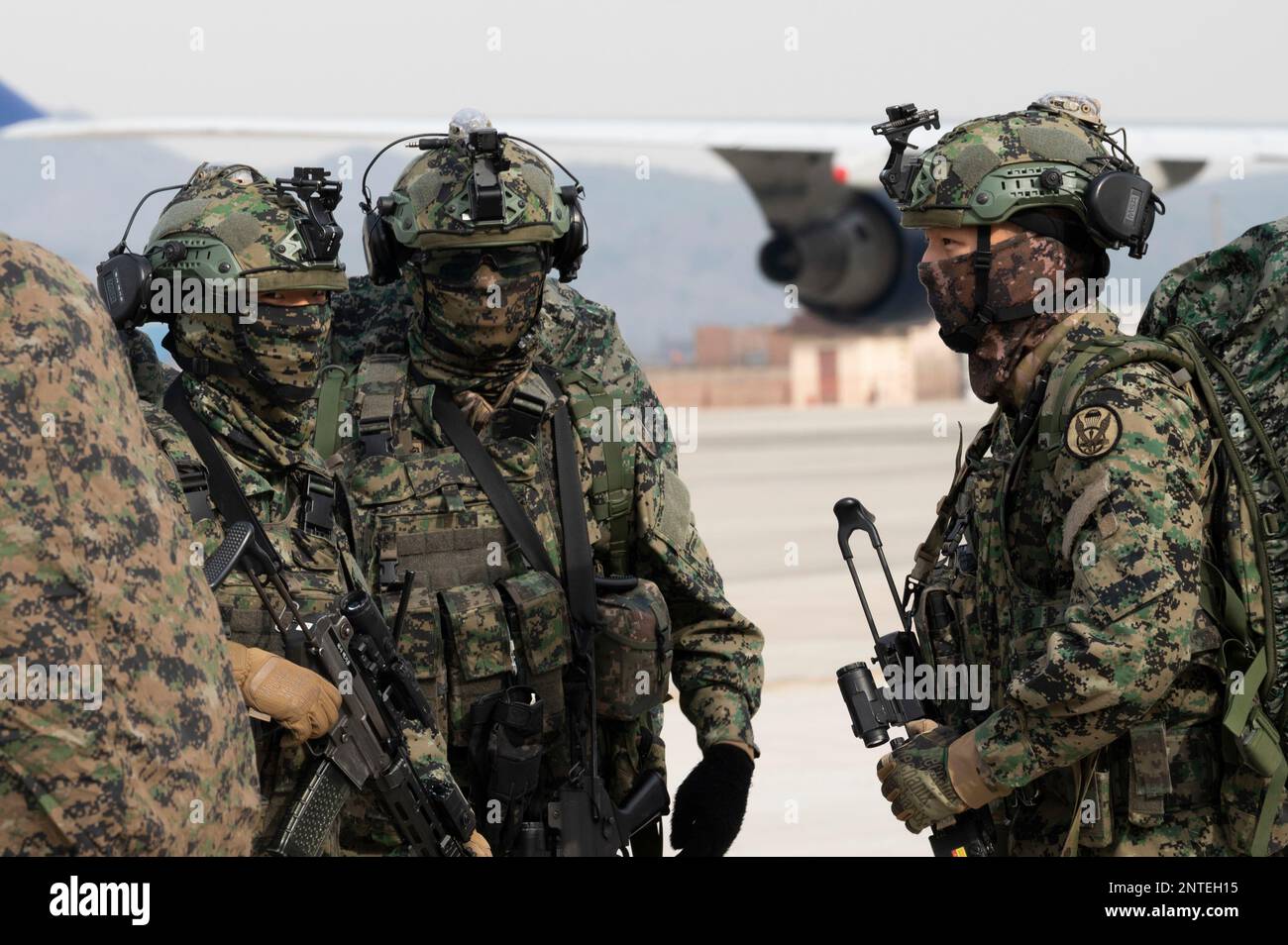 A Republic of Korea Army Special Forces members talk with each other ...