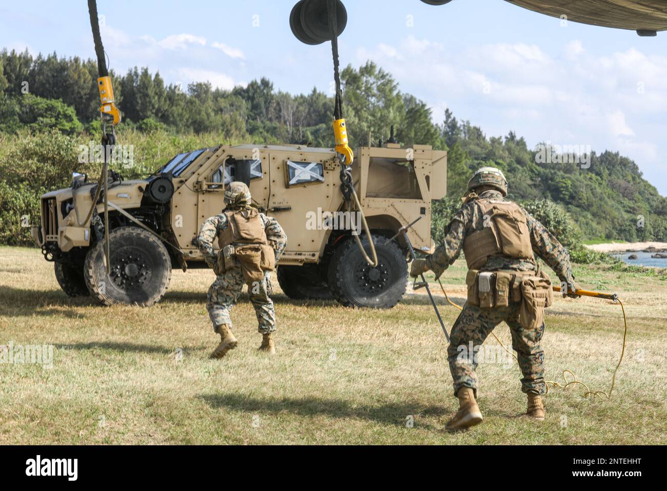 U.S. Marines with Combat Logistics Battalion (CLB) 4 attach a Joint ...