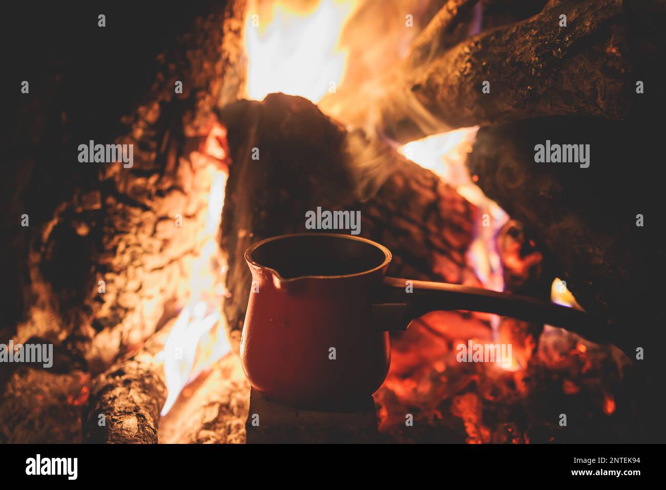 Warm by the fire, cozy winter night in the scandinavian cottage house ...