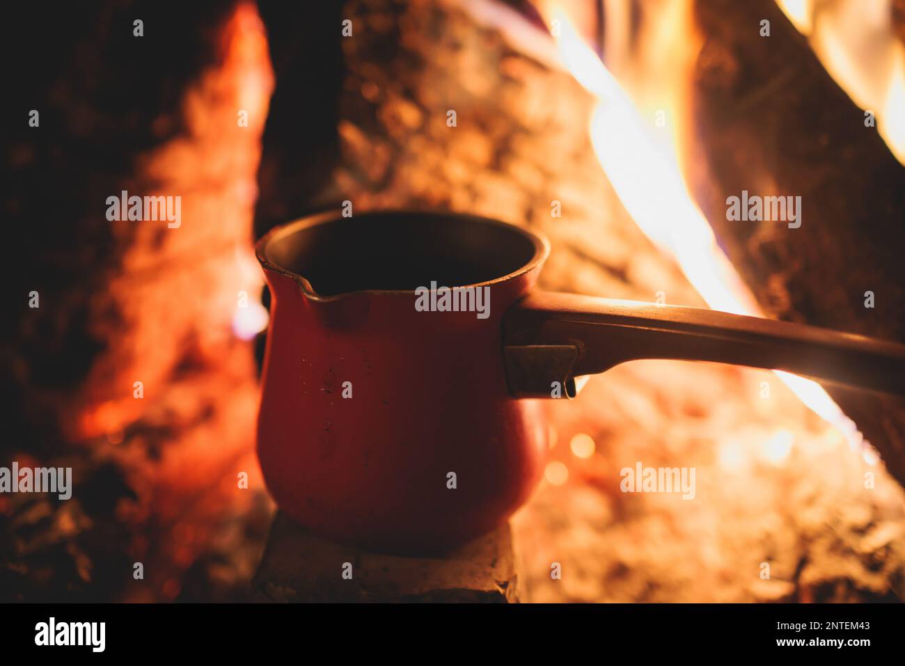 Warm by the fire, cozy winter night in the scandinavian cottage house ...