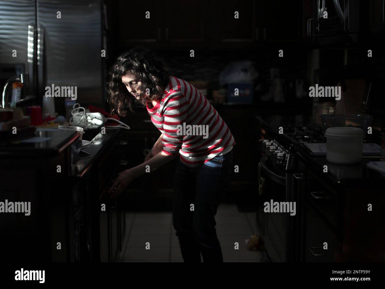 In this March 2019 photo, light from a kitchen window illuminates ...