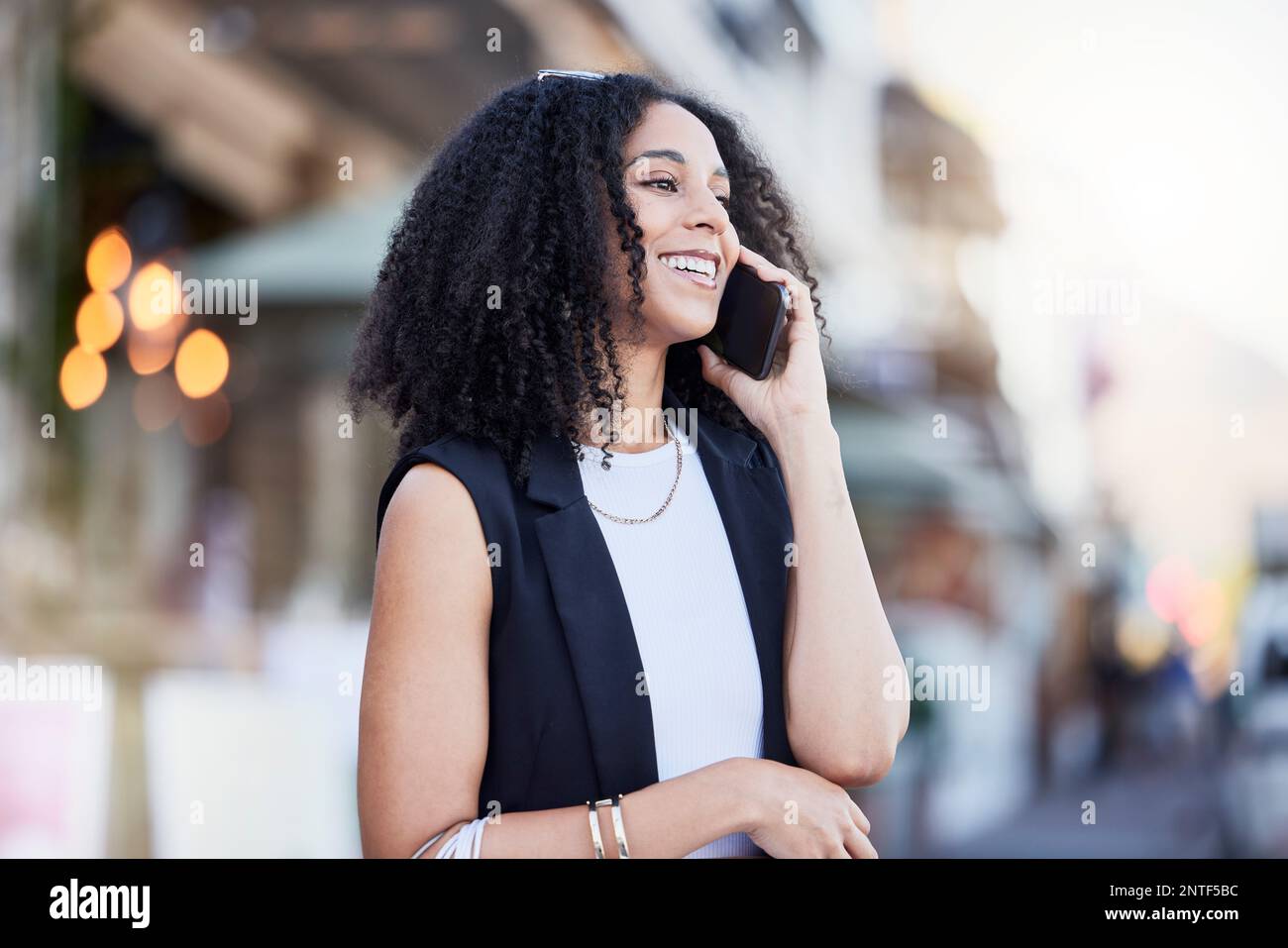 Phone call, black woman and urban street of a young person with ...